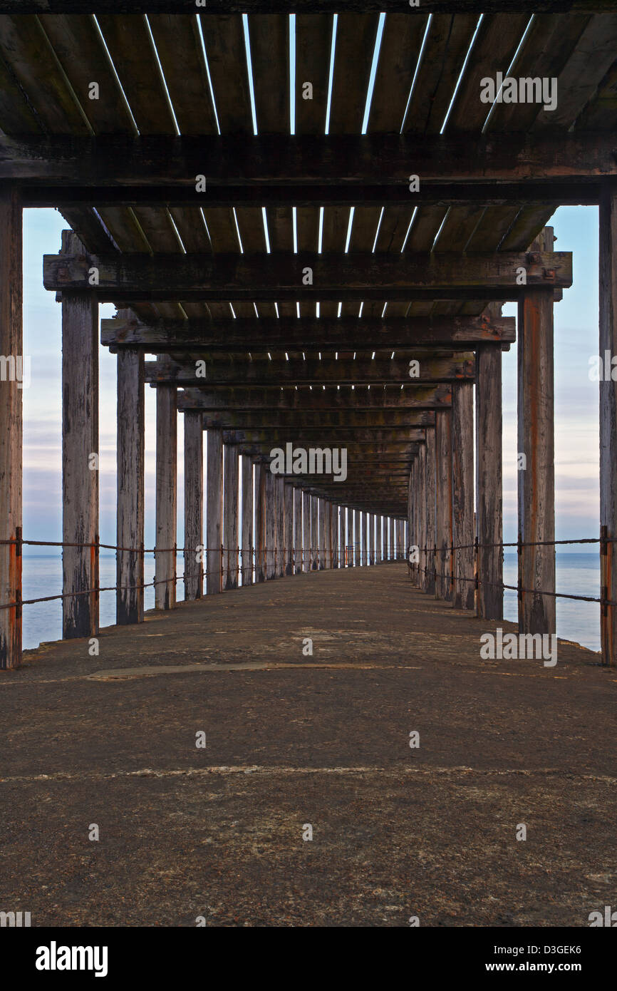 Underneath the boardwalk on Whitby west pier as it gently curves away ...