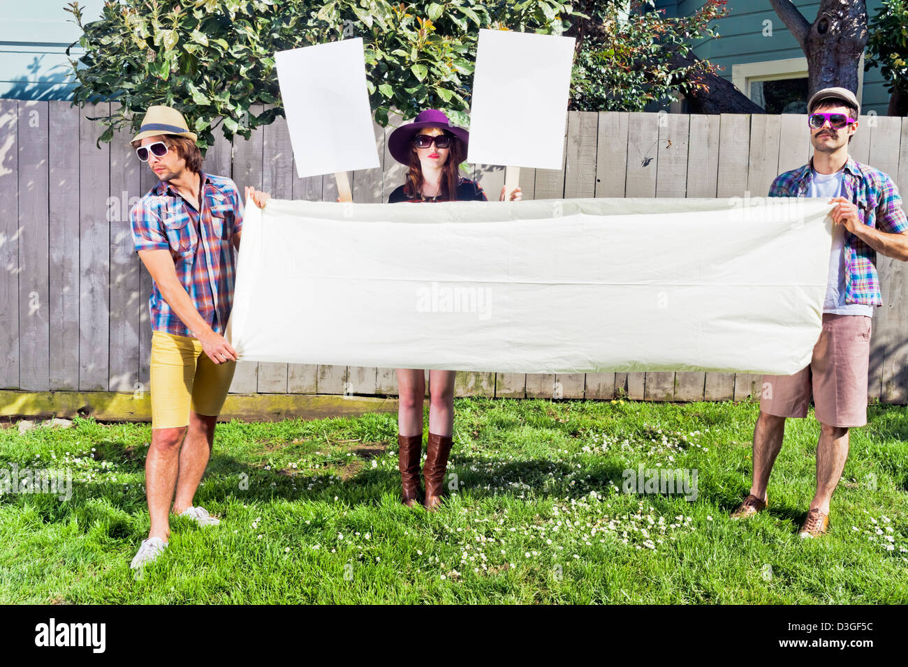 Hipsters and Beatniks - Three hipsters demonstrating while holding ...