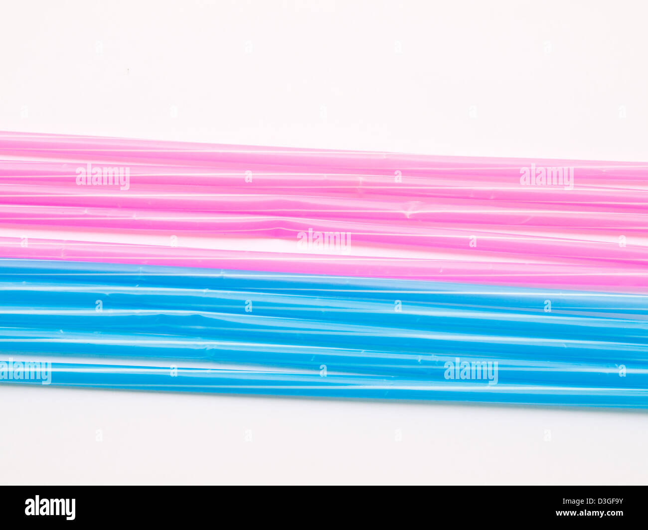 Light blue straws isolated on white background Stock Photo - Alamy