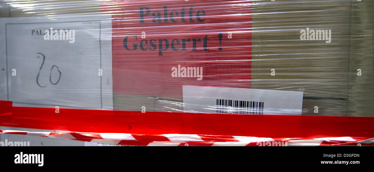 The writing "Pallet Banned!" hangs on a pallet of pre-made noodle ...