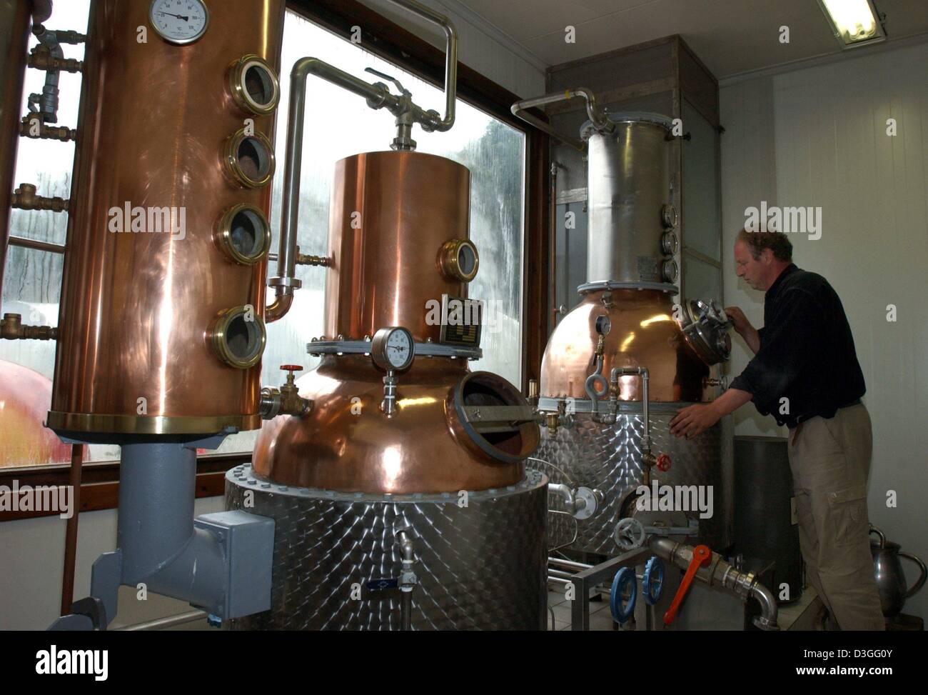 (dpa) - Liquor brewer Axel Muenster checks the boiler of a brewing ...