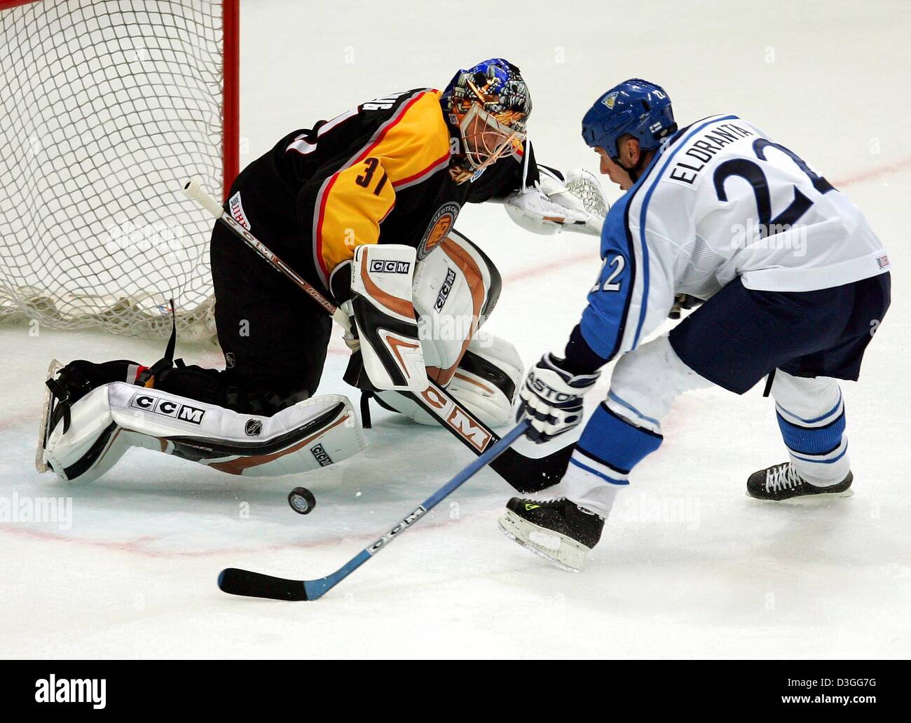 (dpa) - German goalkeeper Olaf Koelzig (L) defends his goal against ...