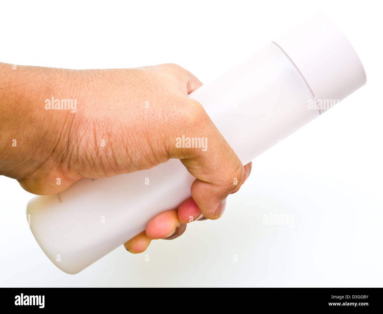 A pink plastic bottle hold by hand isolated on white background Stock ...