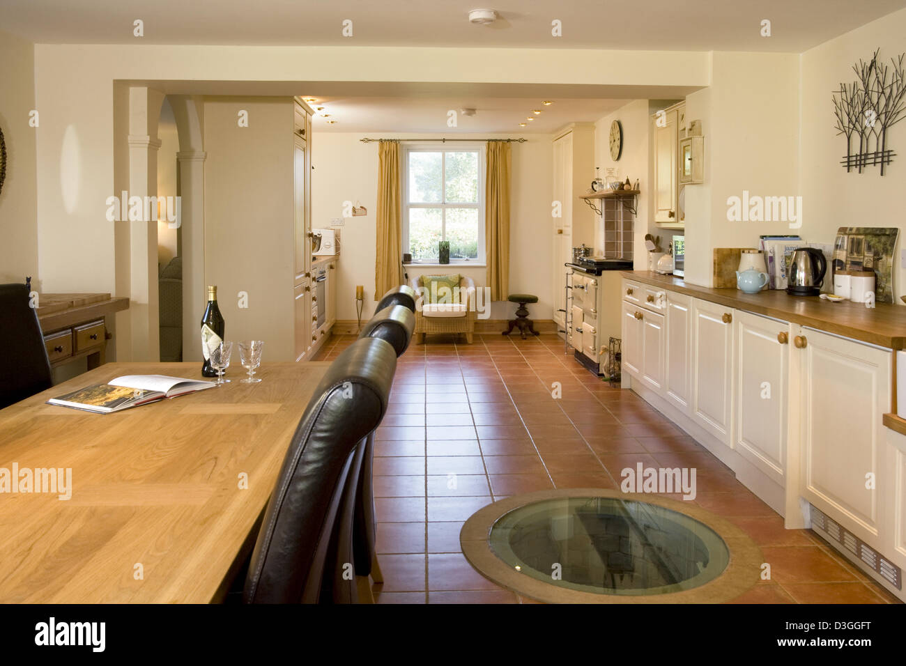 A contemporary kitchen with an original well featured in the floor ...
