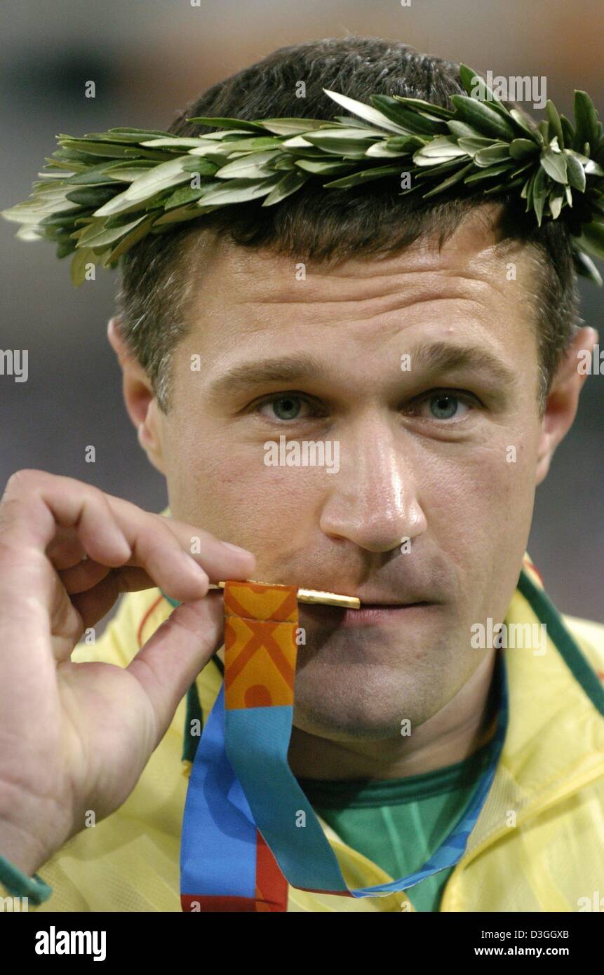 Biting the gold medal hi-res stock photography and images - Alamy