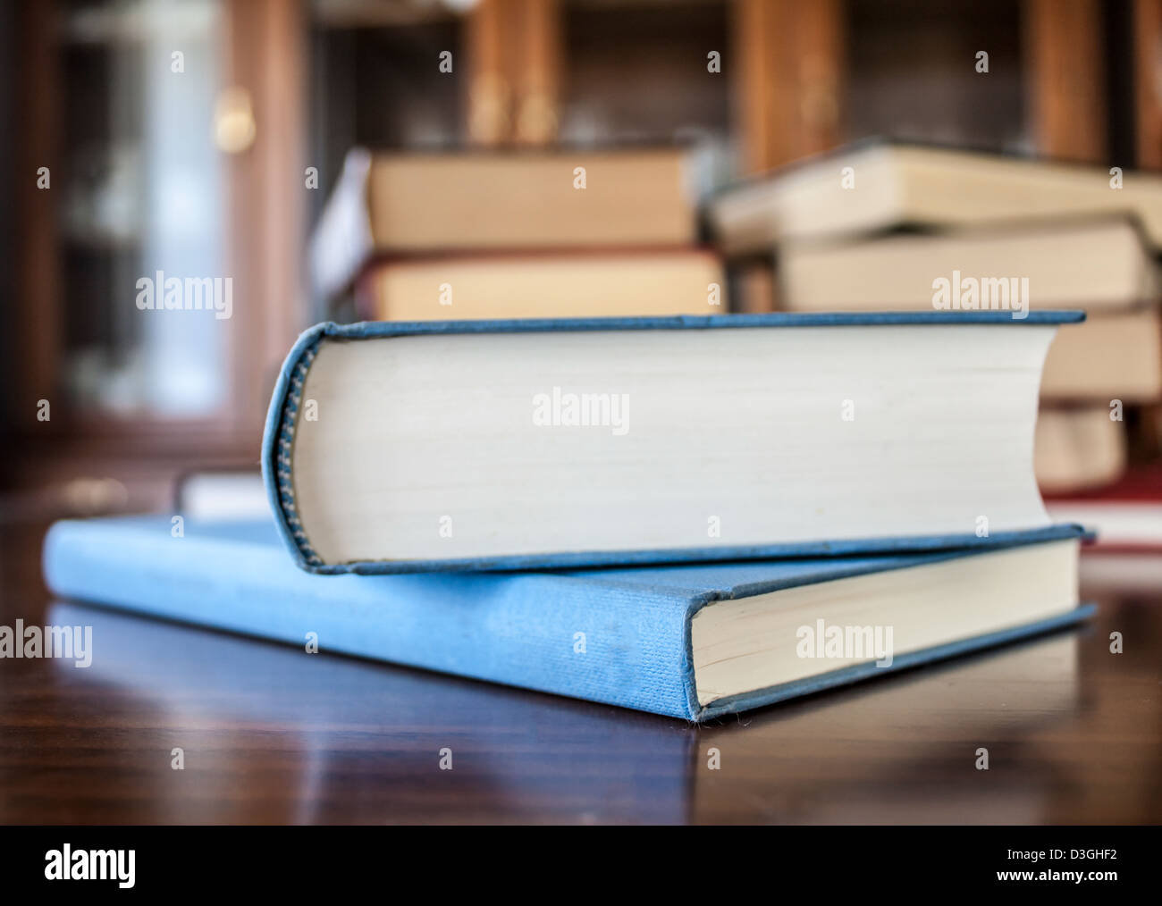 Many different sized colored and shaped books on wood table Stock Photo ...