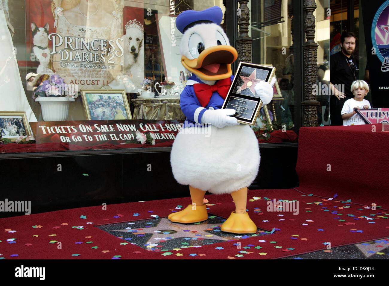 (dpa) - A person dressed as Donald Duck poses in front of his newly ...