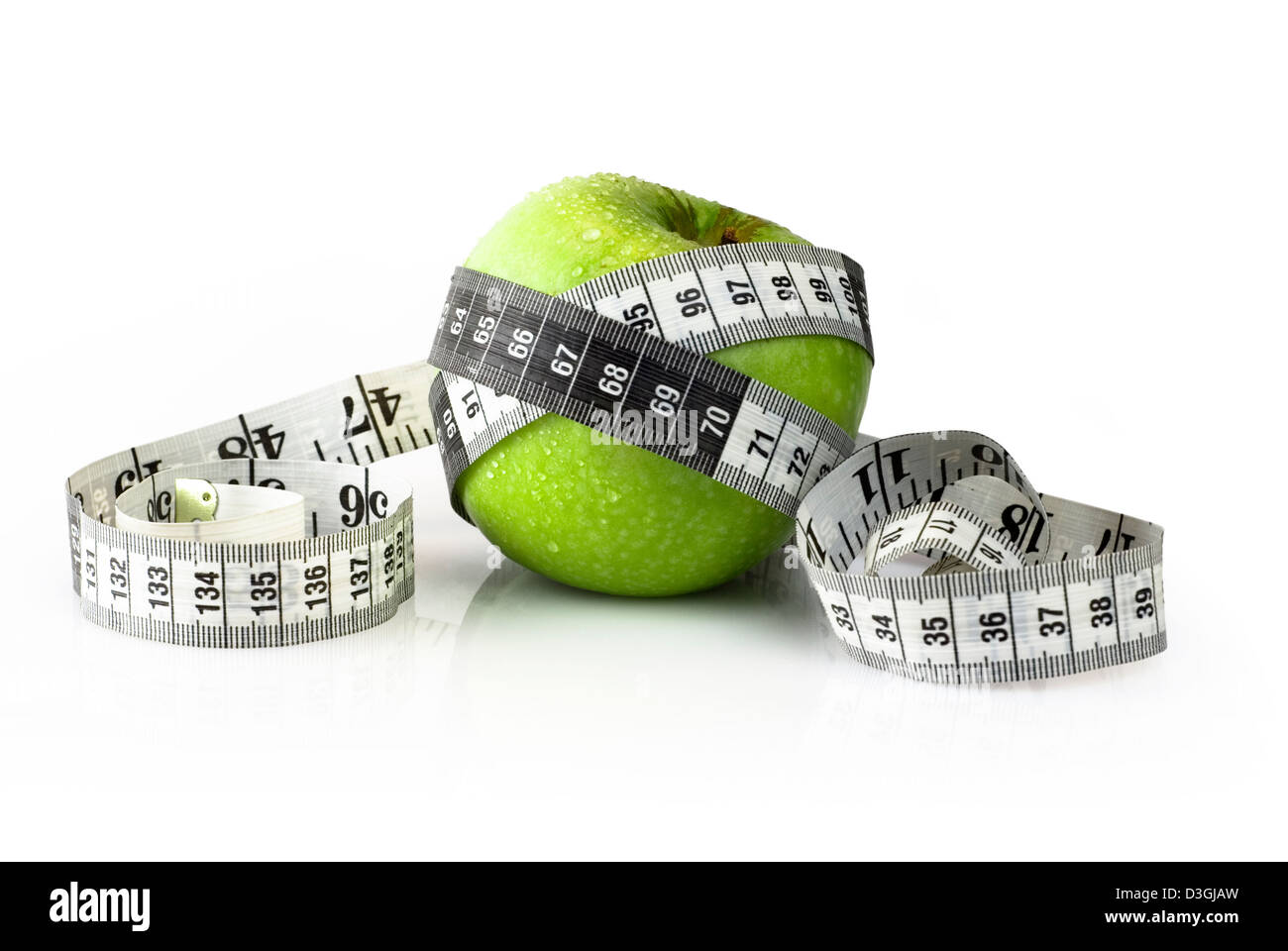 Measurement tape wrapped around a green apple Stock Photo - Alamy