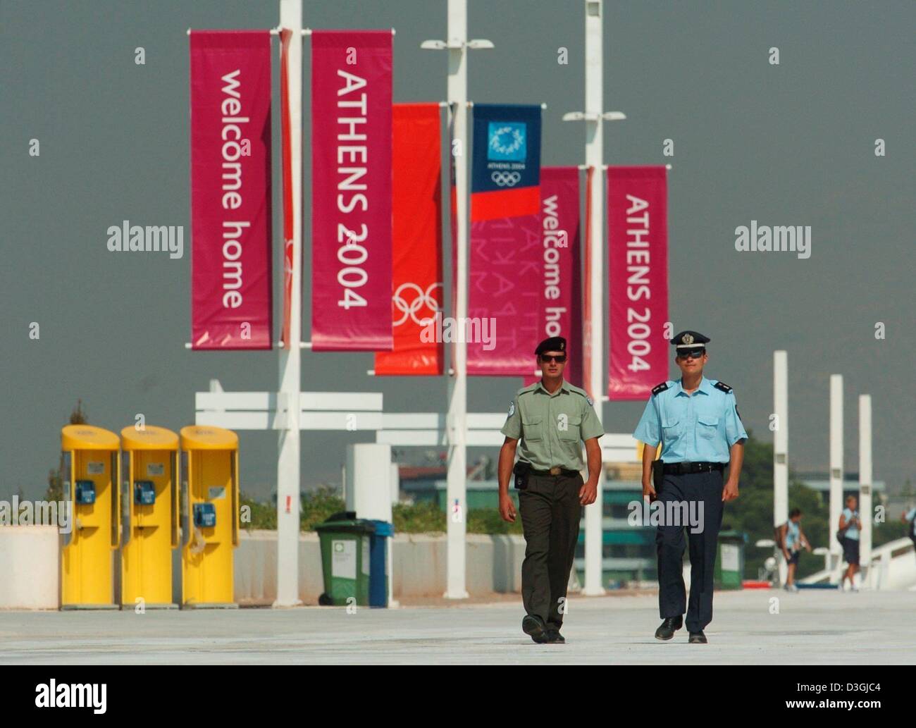 (dpa) - Two Greek police officers patrol in front of the Olympic ...