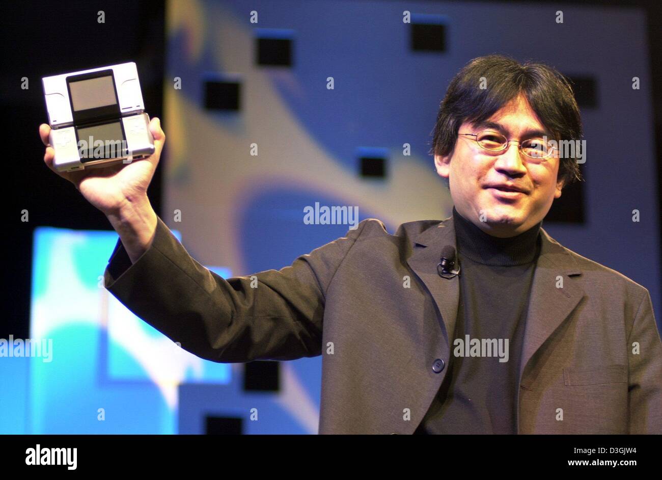 (dpa) - Satoru Iwata, president of Nintendo, smiles as presents the new ...