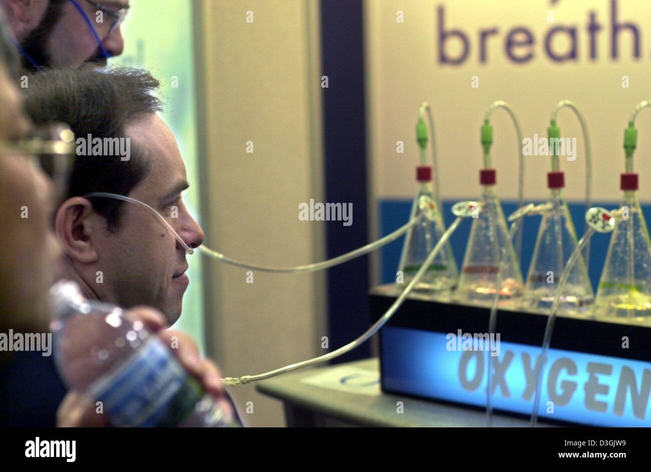 (dpa) - Visitors try out the oxygen-bar at a stand during the BIO 2004 ...