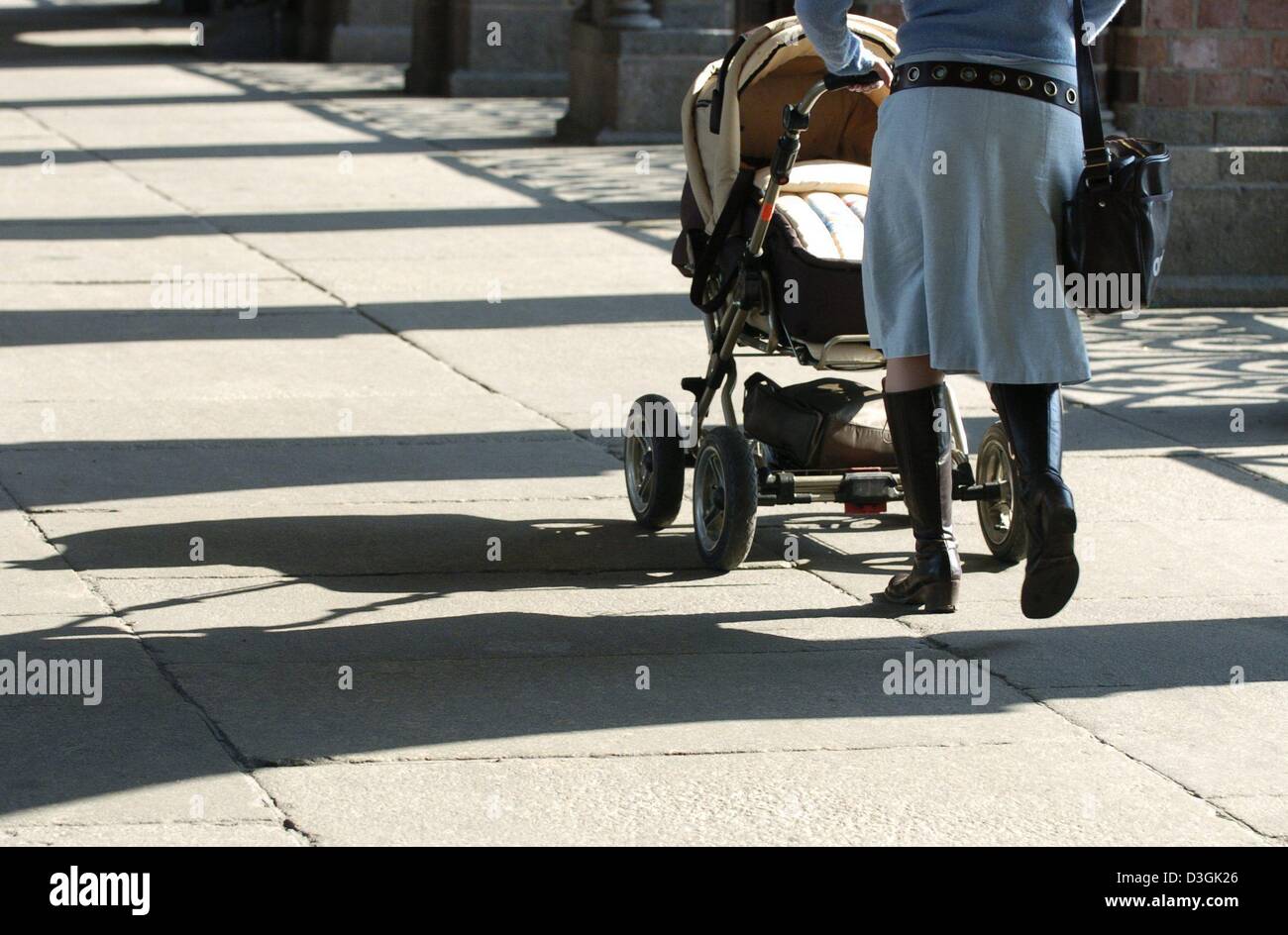 Woman pushes a pram hi-res stock photography and images - Alamy