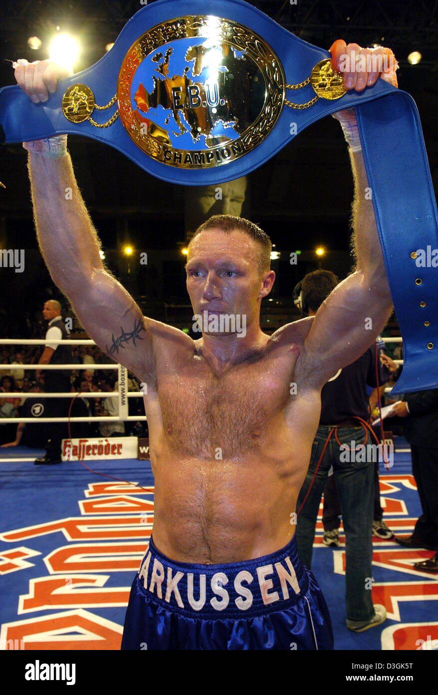 (dpa) - Danish boxer Rudy Markussen holds up his new championship belt ...