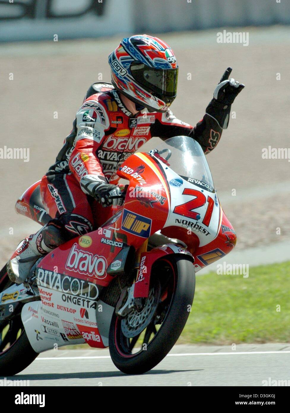 (dpa) - German motorcyclist Steve Jenkner of team Aprilia raises his ...