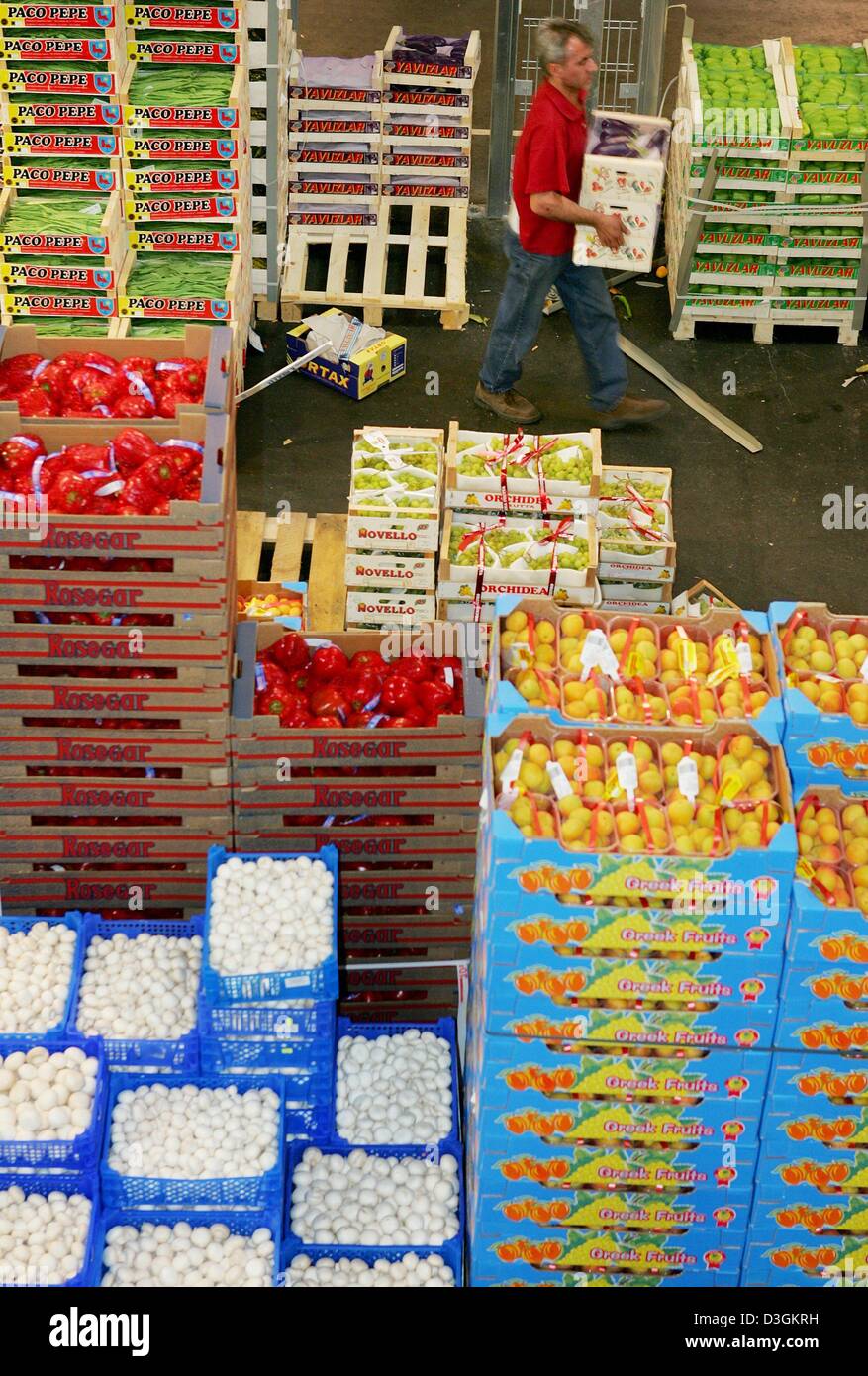 (dpa) - Fresh vegetables and fruits in boxes are stacked up at the ...