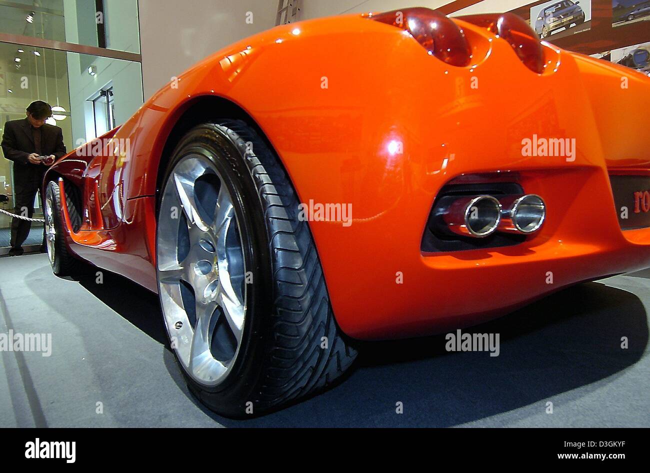 (dpa) - A visitor inspects the prototype 'Ferrari Rossa' at the Design ...