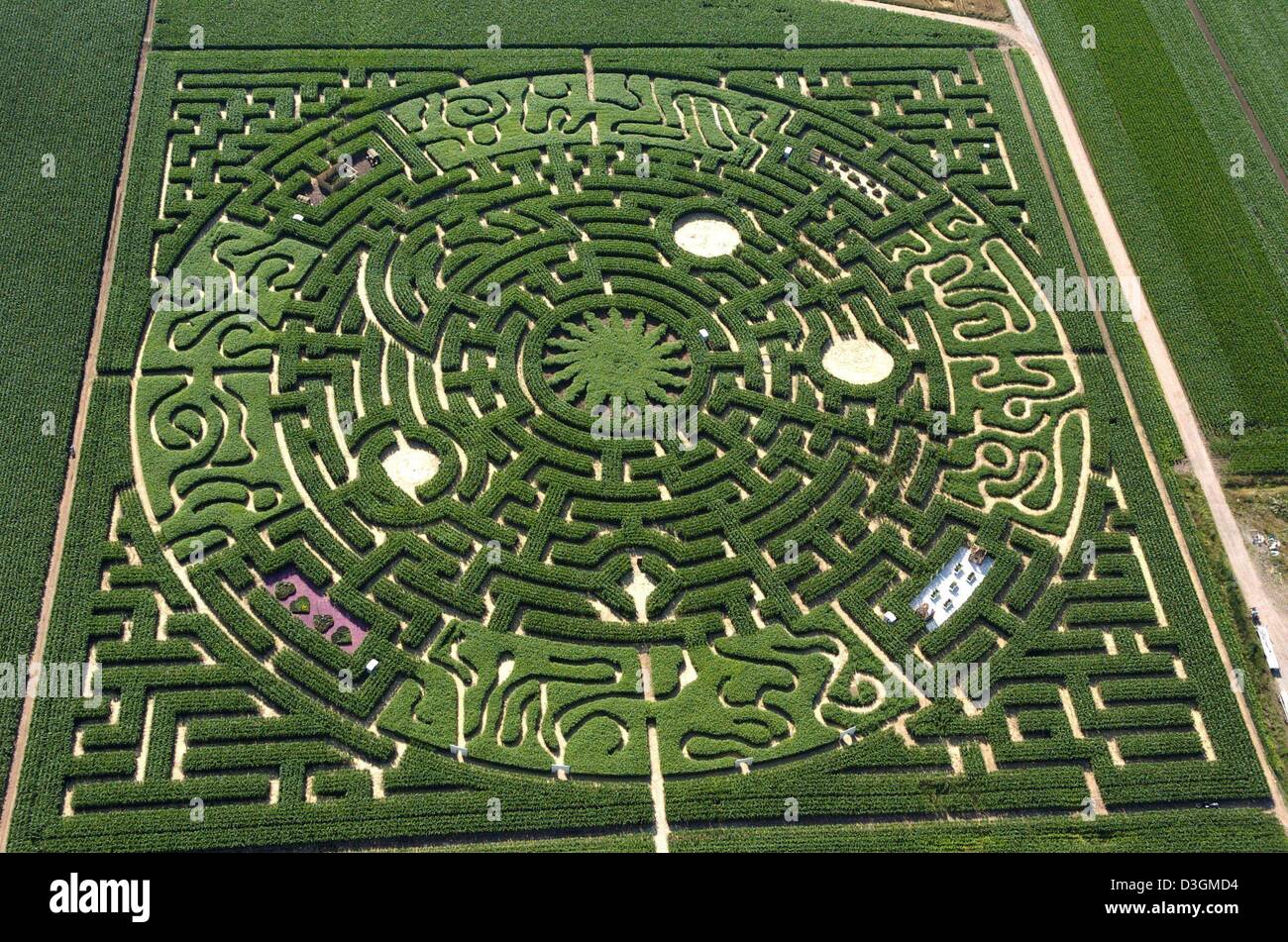 (dpa) - An aerial view of a maze in a corn field with a sun symbol in ...