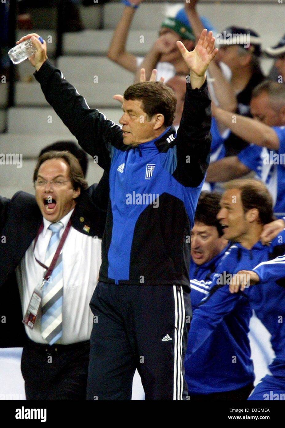 (dpa) - Greece's German soccer coach Otto Rehhagel raises his arms ...