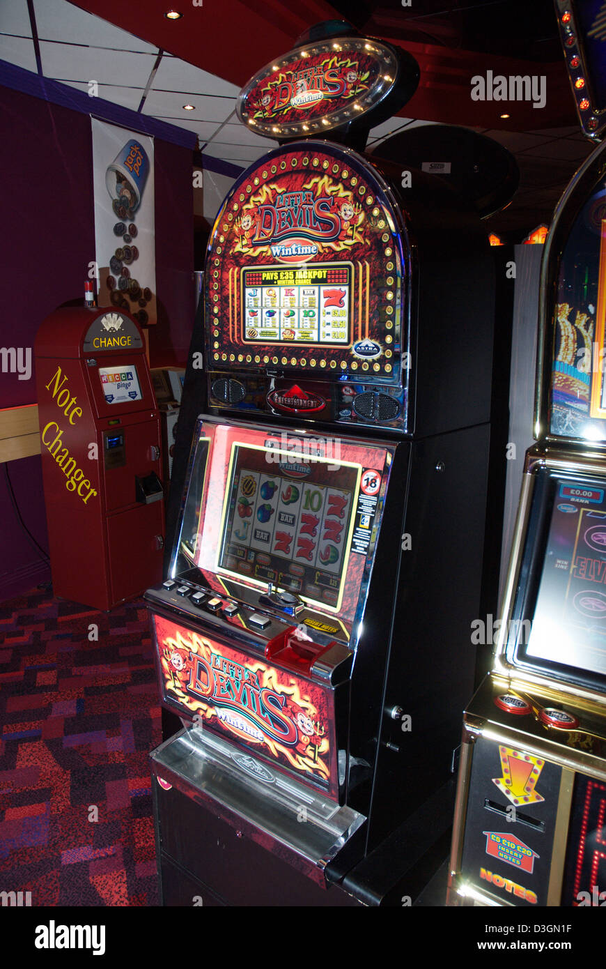 Fruit machines in amusement arcade UK Stock Photo - Alamy