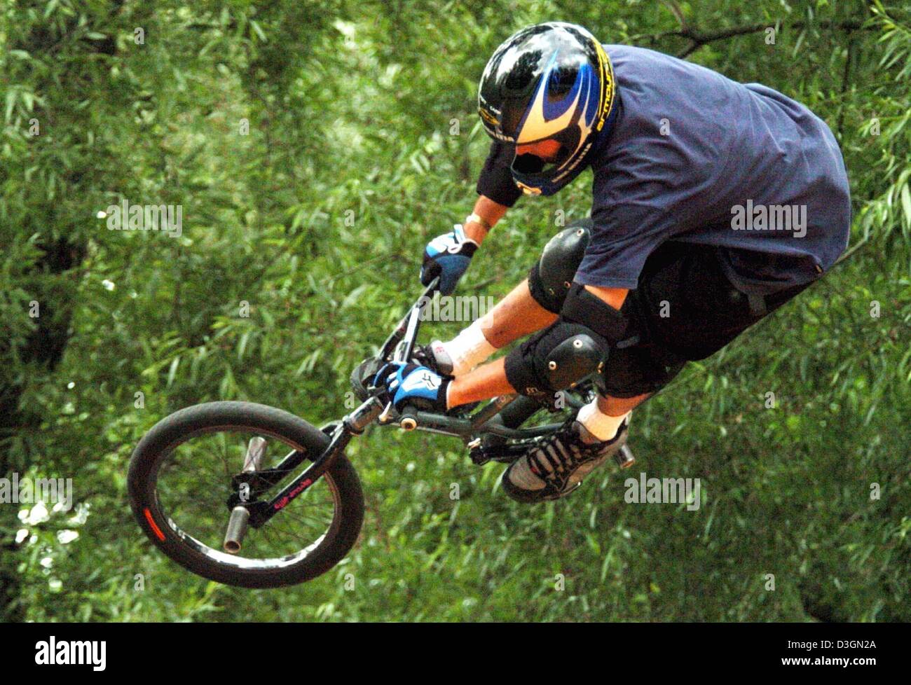 (dpa) - A Freestyle BMX rider jumps from a ramp in Cologne, Germany, 24 ...