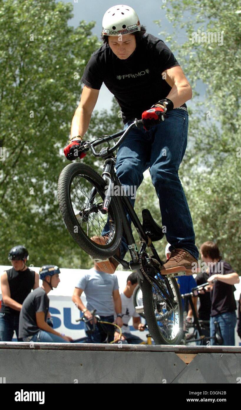 (dpa) - A Freestyle BMX rider jumps over a ramp in Cologne, Germany, 24 ...