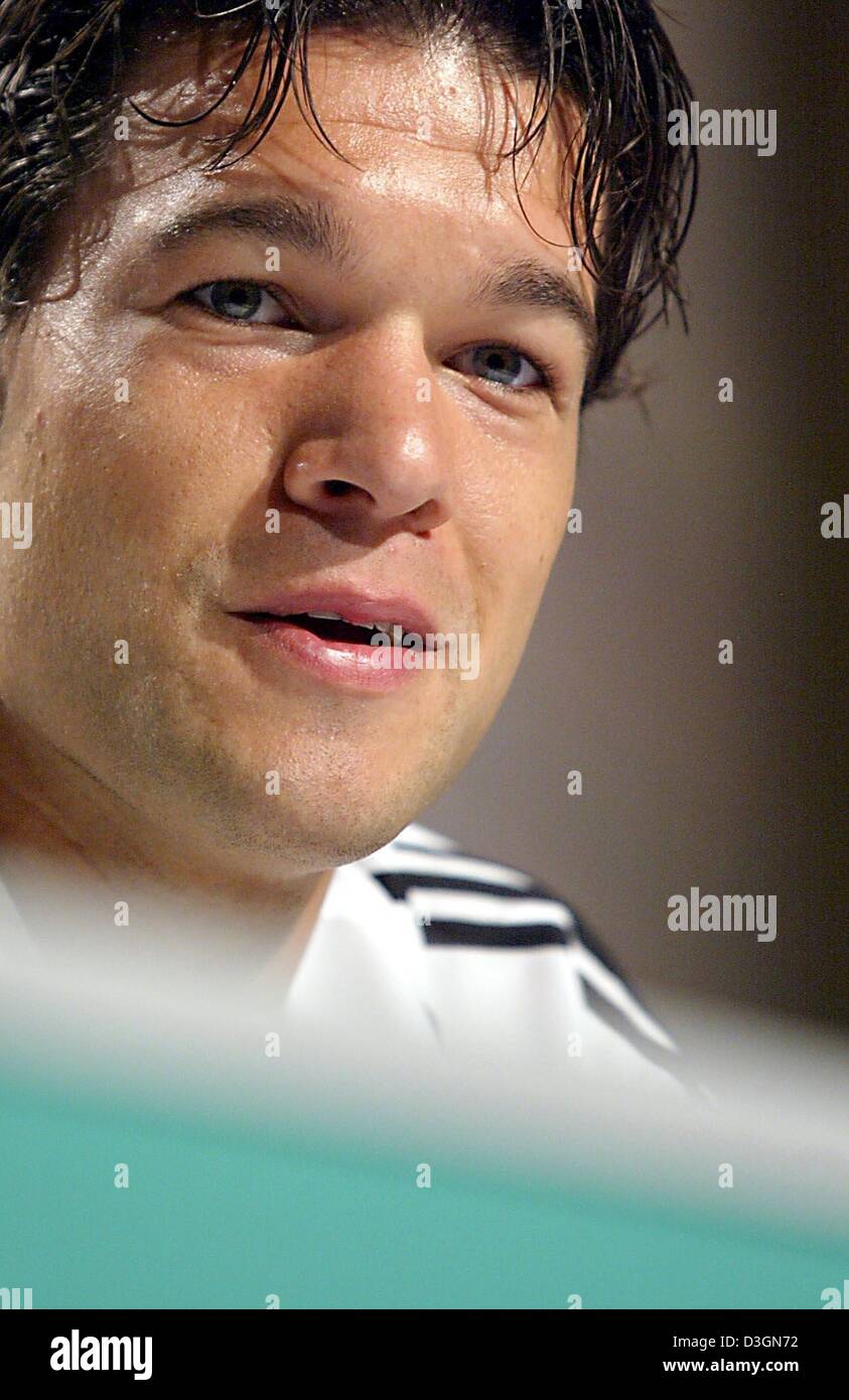 (dpa) - German national team midfielder Michael Ballack listens to a ...