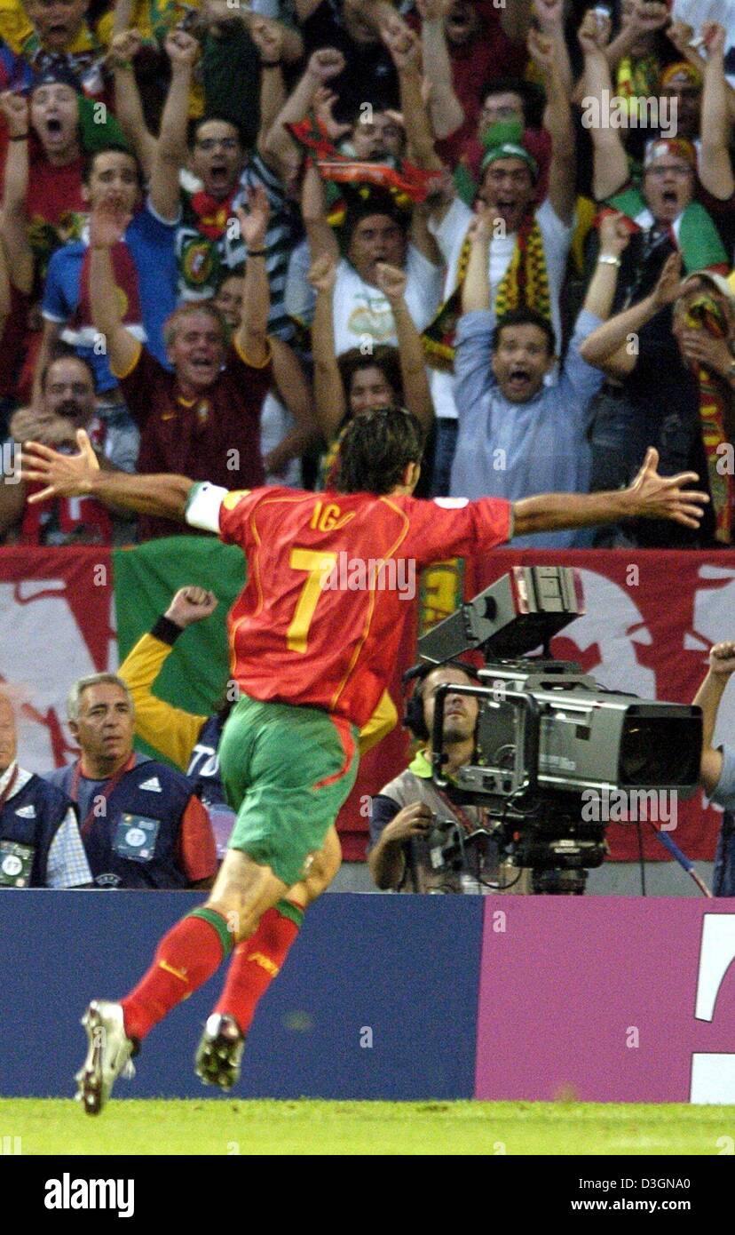 (dpa) - Portugal midfielder and team captain Luis Figo spreads his arms ...