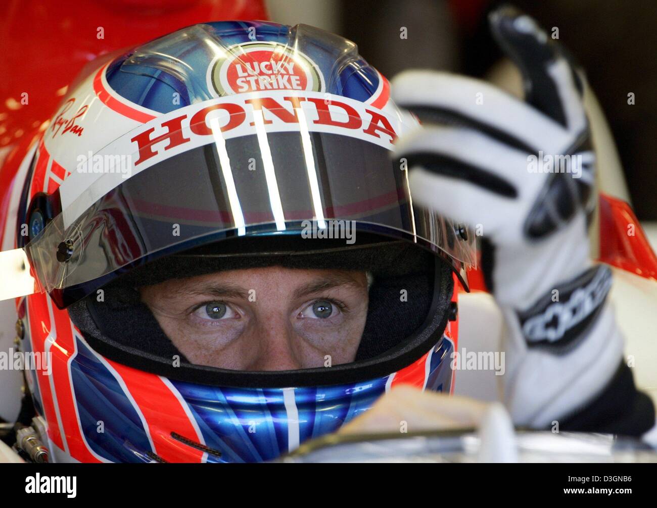 (dpa) - British formula one pilot Jenson Button of BAR Honda puts on ...