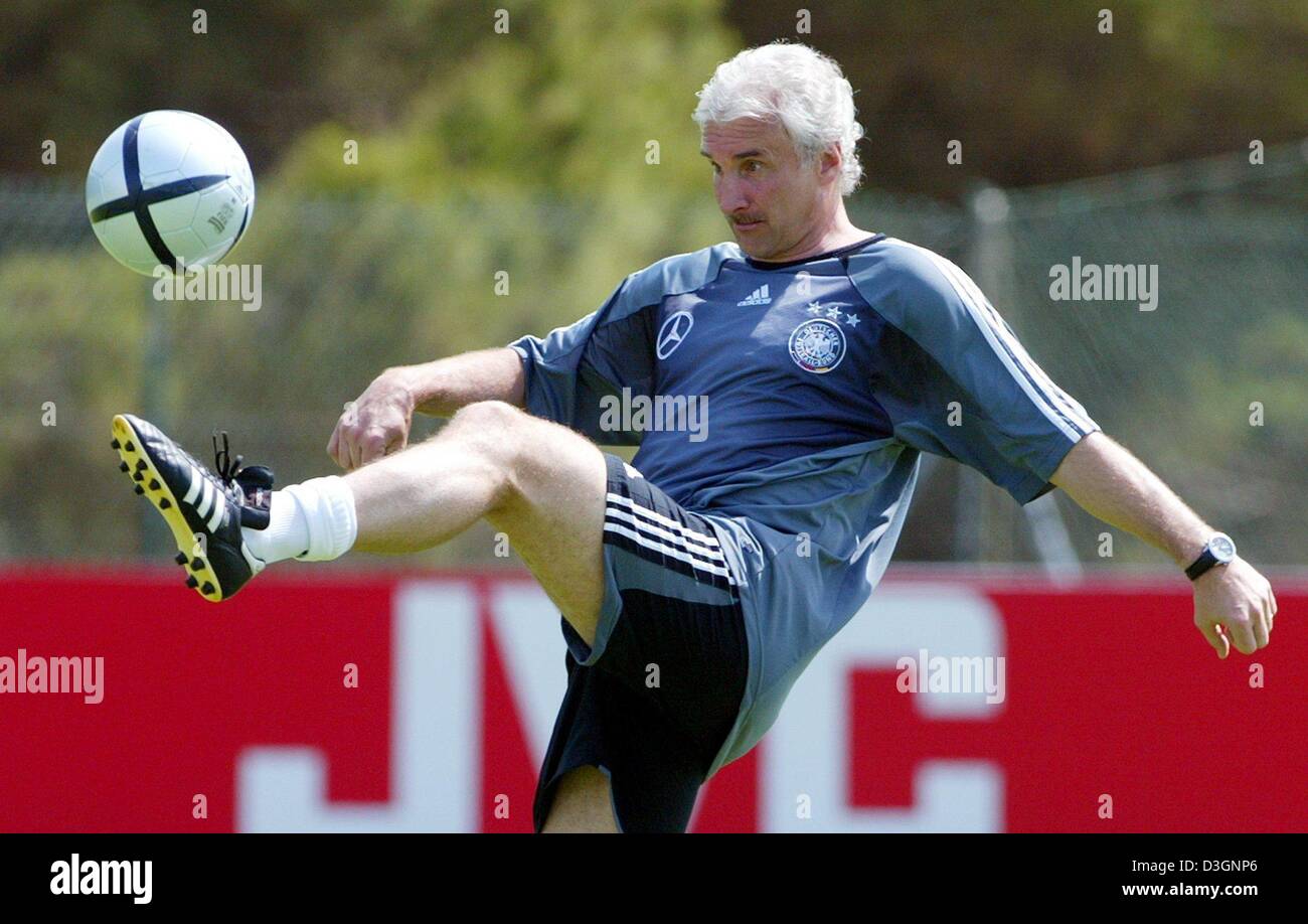 (dpa) - German soccer coach Rudi Voeller kicks the ball during a ...