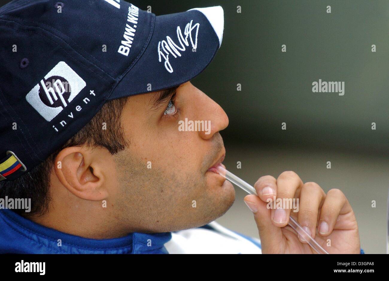 (dpa) The Colombian F1 pilot Juan-Pablo Montoya (BMW-Williams), sips at ...