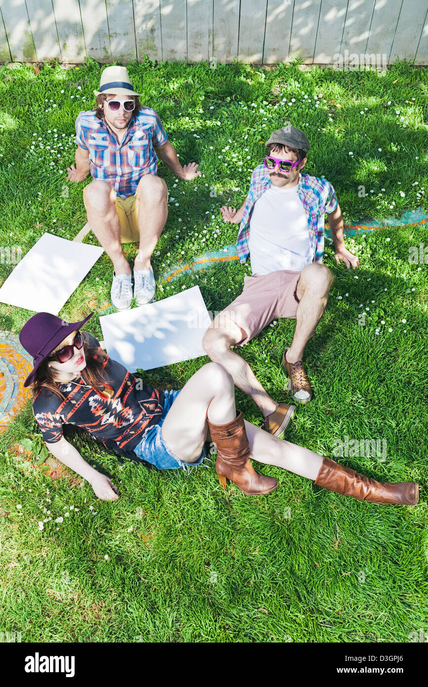 Hipsters and Beatniks - Three hipsters demonstrating while holding ...