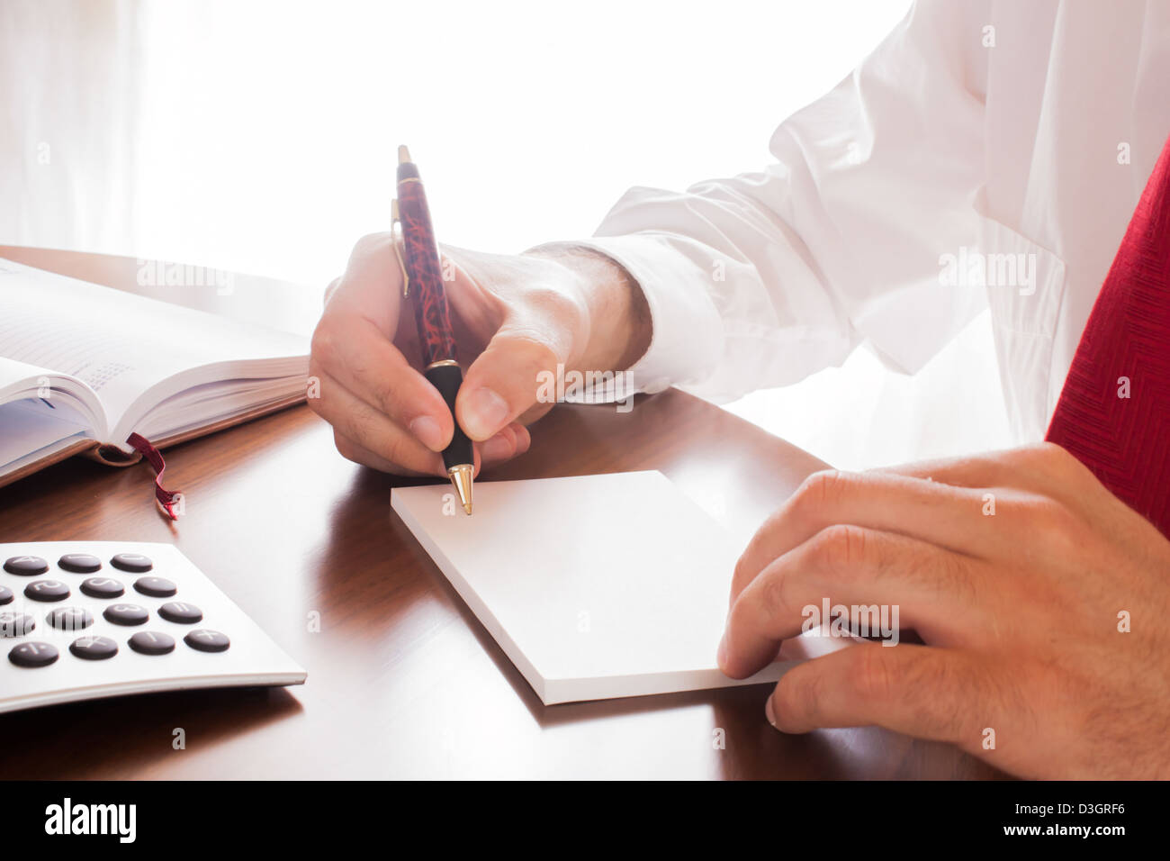 business man writing notes in the office table Stock Photo - Alamy