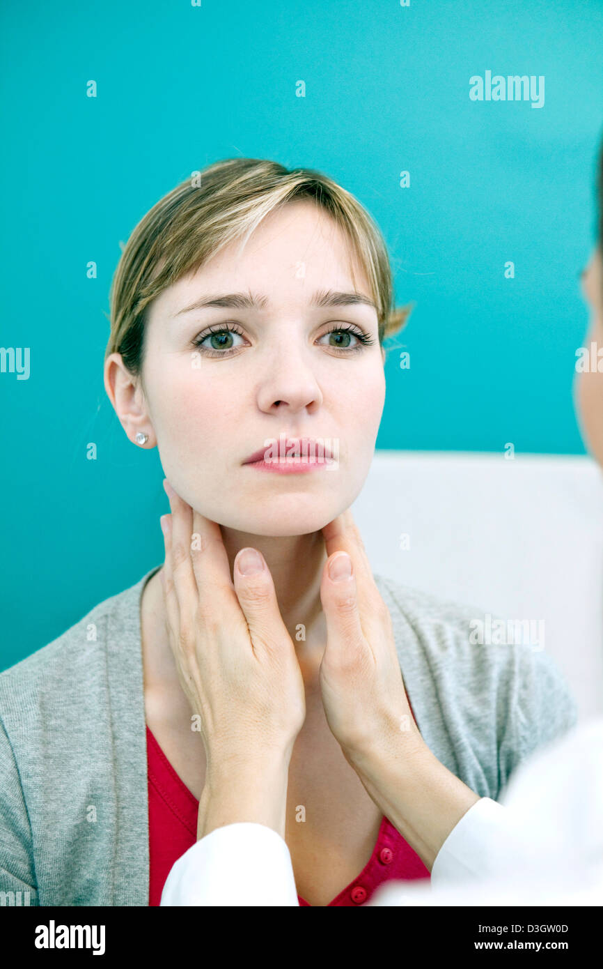 WOMAN PALPATING LYMPH NODE Stock Photo - Alamy