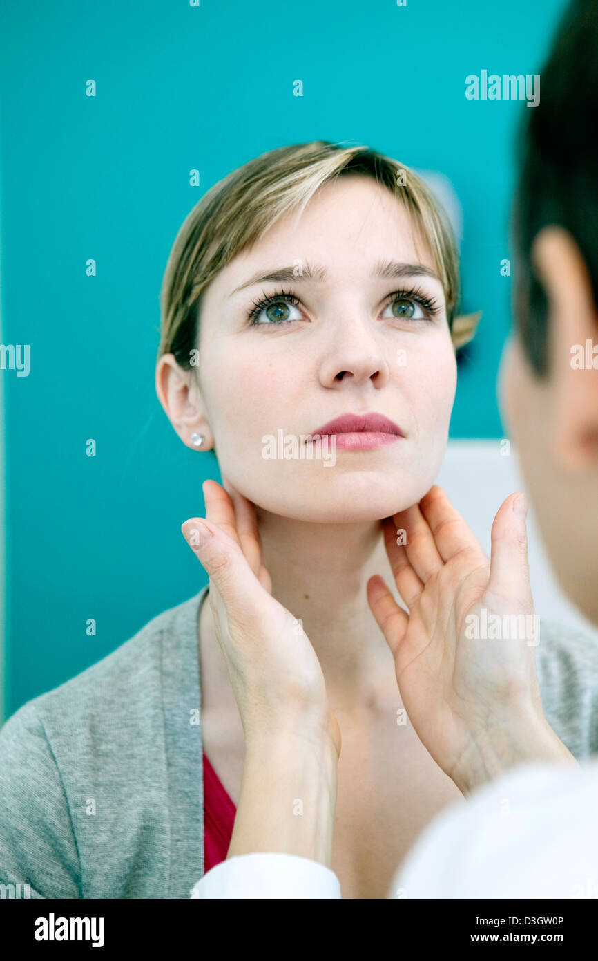 WOMAN PALPATING LYMPH NODE Stock Photo - Alamy