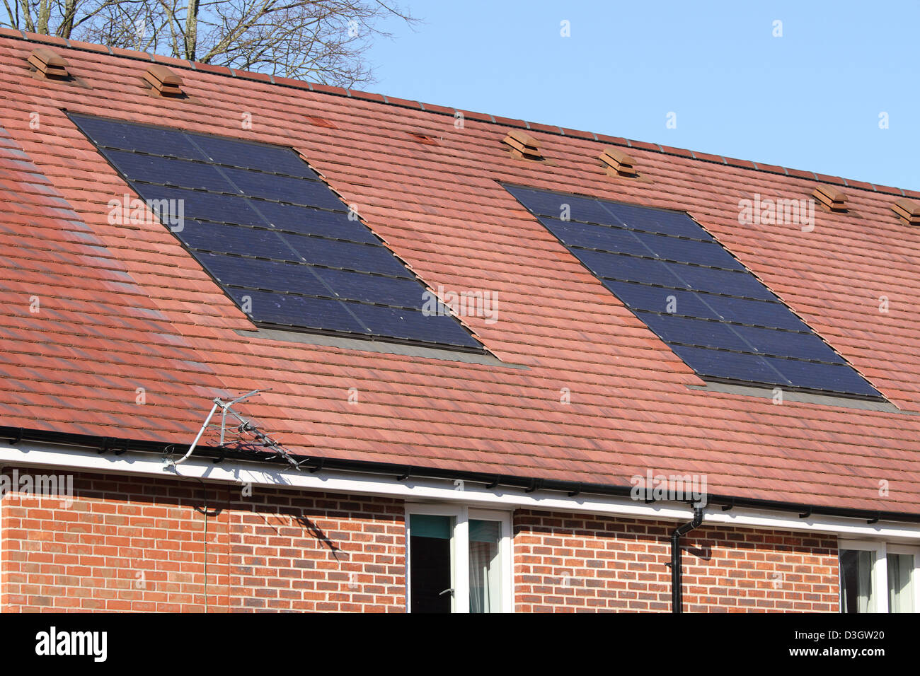 Solar photovoltaic panel arrays on house roof Stock Photo - Alamy