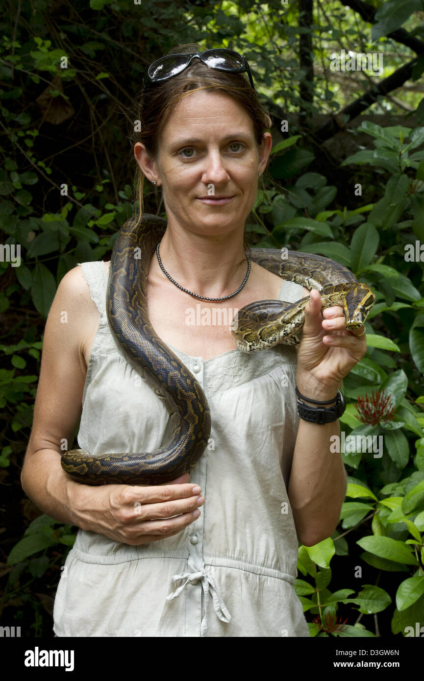 Tourist holding a python, Mamba Village, Mombasa, Kenya Stock Photo - Alamy