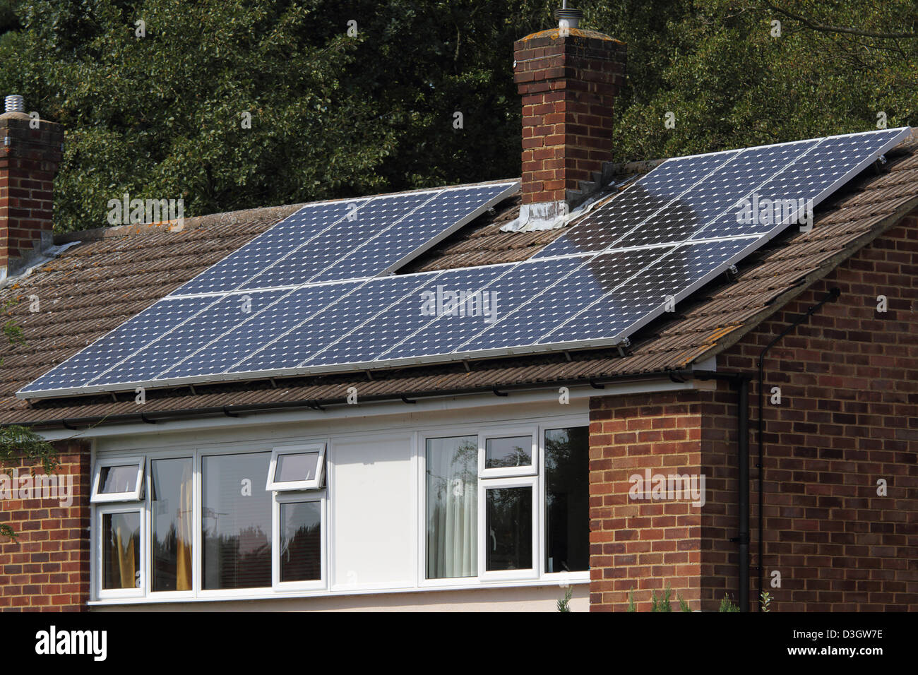 Solar photovoltaic panel array on house roof Stock Photo - Alamy