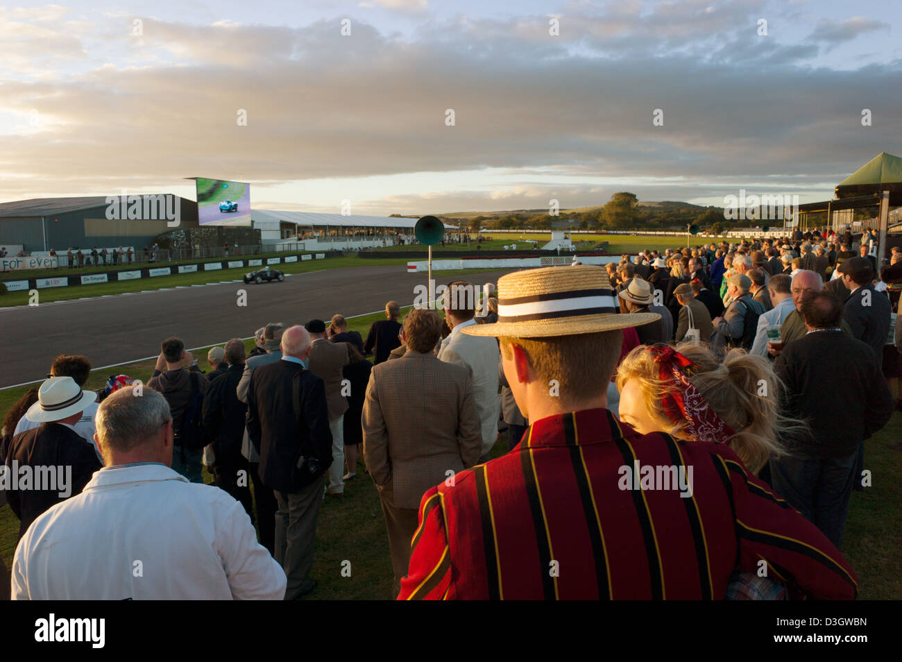 Young couple in crowd watching Goodwood Revival Race Stock Photo - Alamy