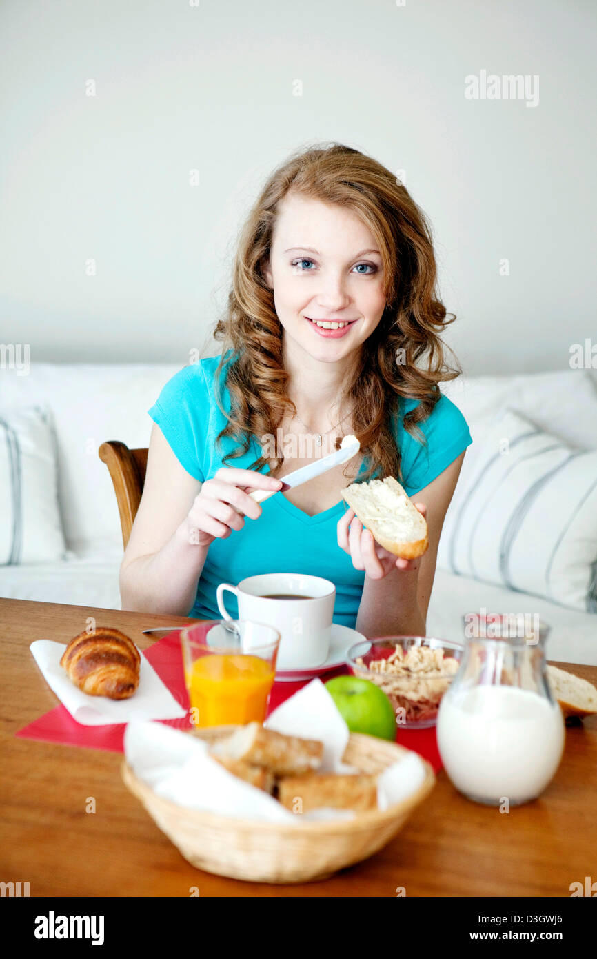 WOMAN EATING BREAKFAST Stock Photo - Alamy