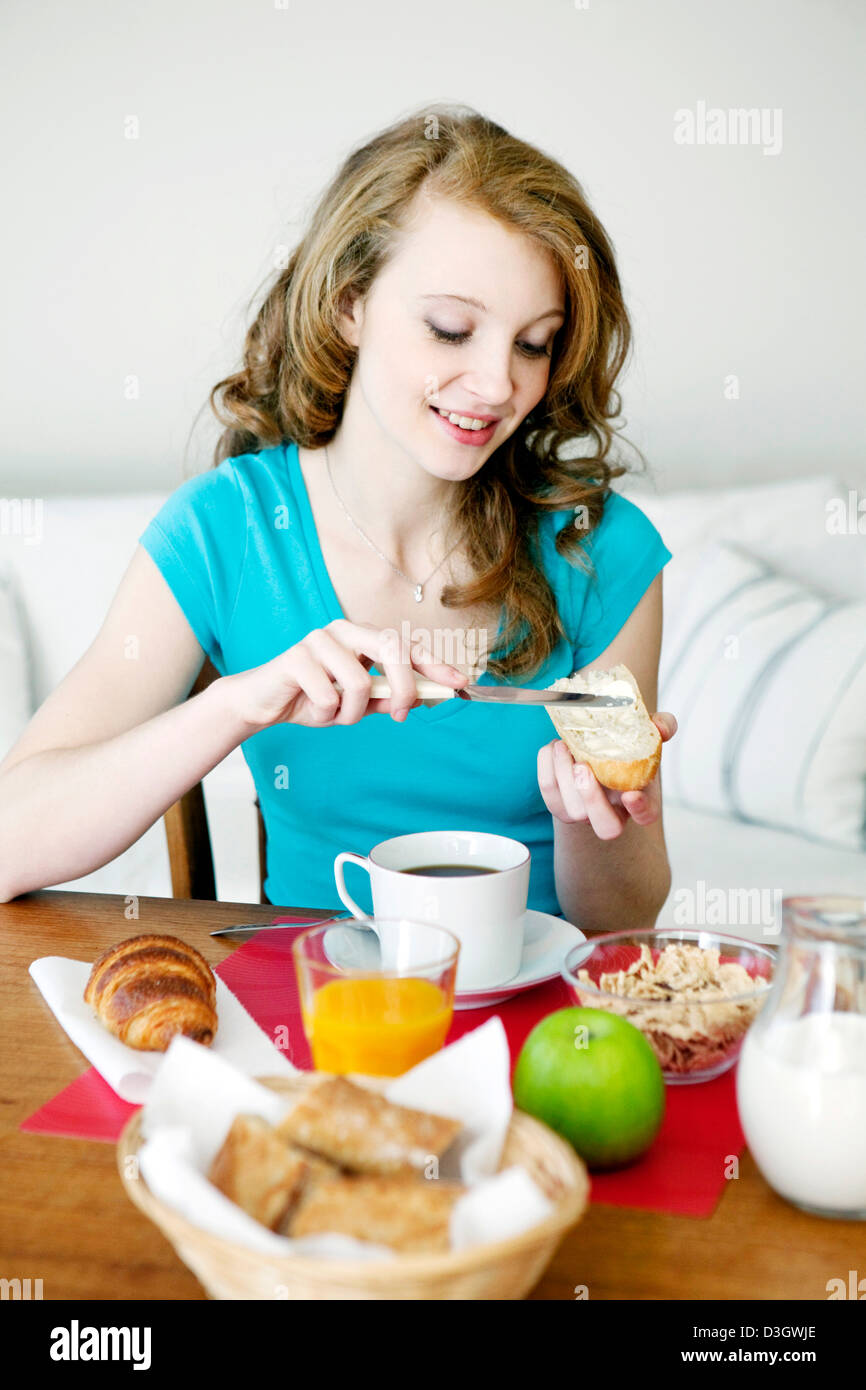 WOMAN EATING BREAKFAST Stock Photo - Alamy
