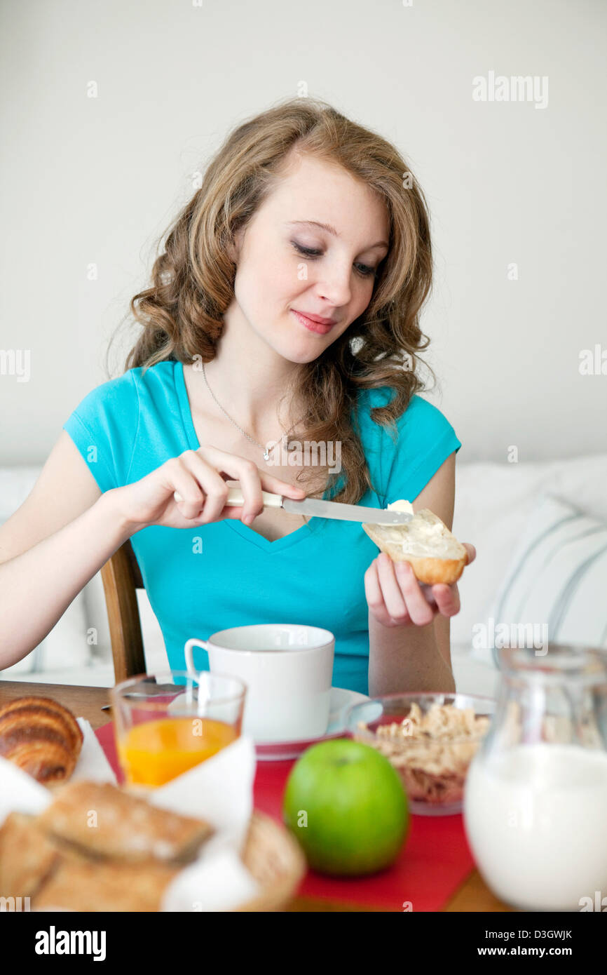 WOMAN EATING BREAKFAST Stock Photo - Alamy