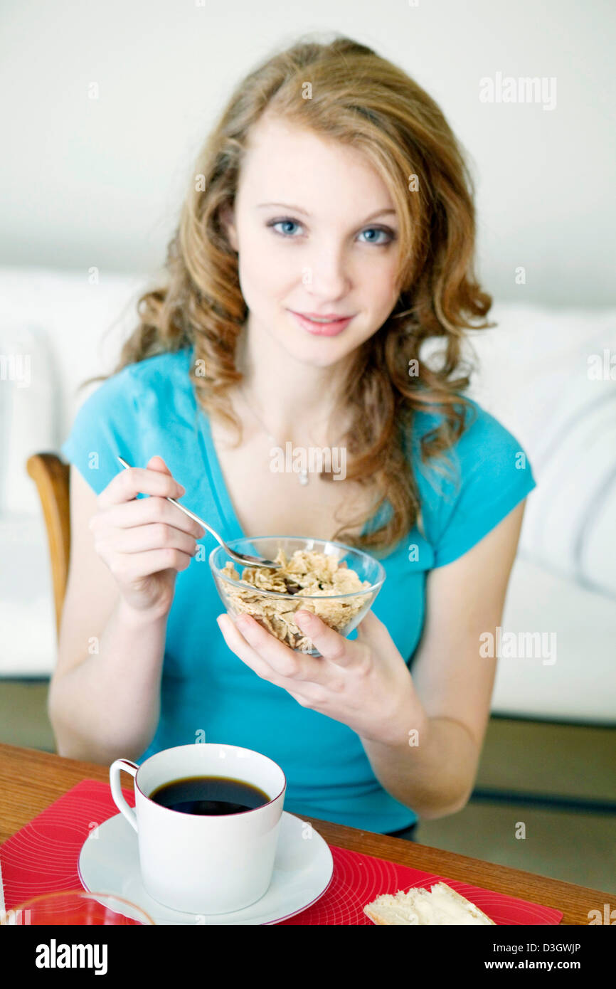 WOMAN EATING BREAKFAST Stock Photo - Alamy