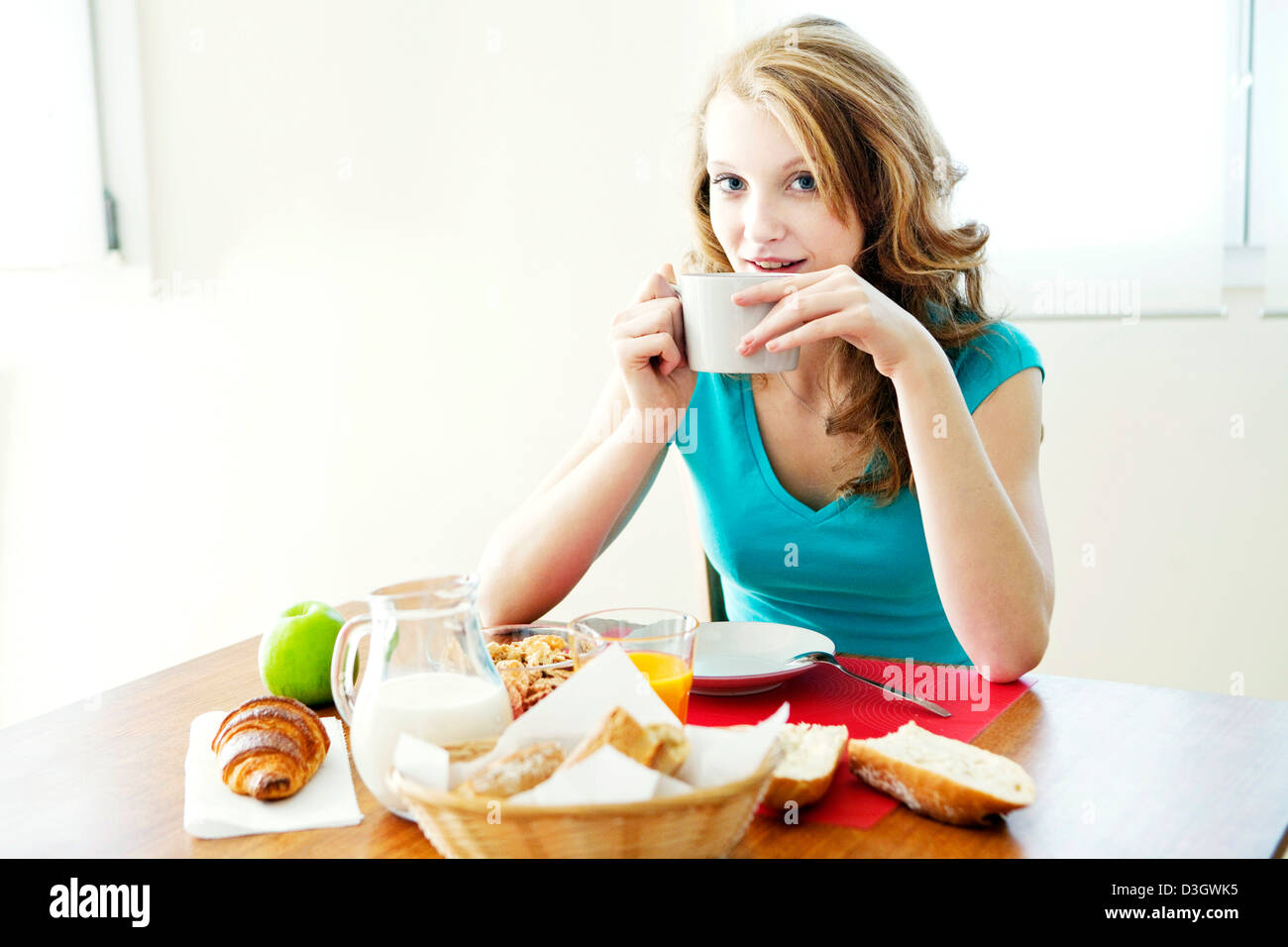 WOMAN EATING BREAKFAST Stock Photo - Alamy