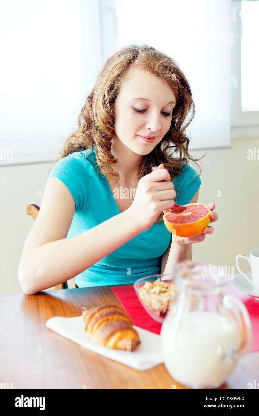 WOMAN EATING BREAKFAST Stock Photo - Alamy