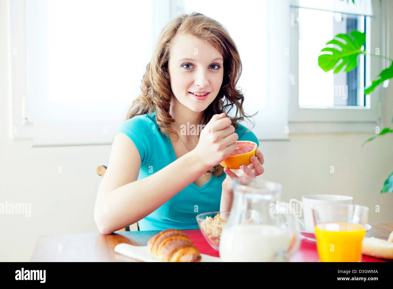 WOMAN EATING BREAKFAST Stock Photo - Alamy