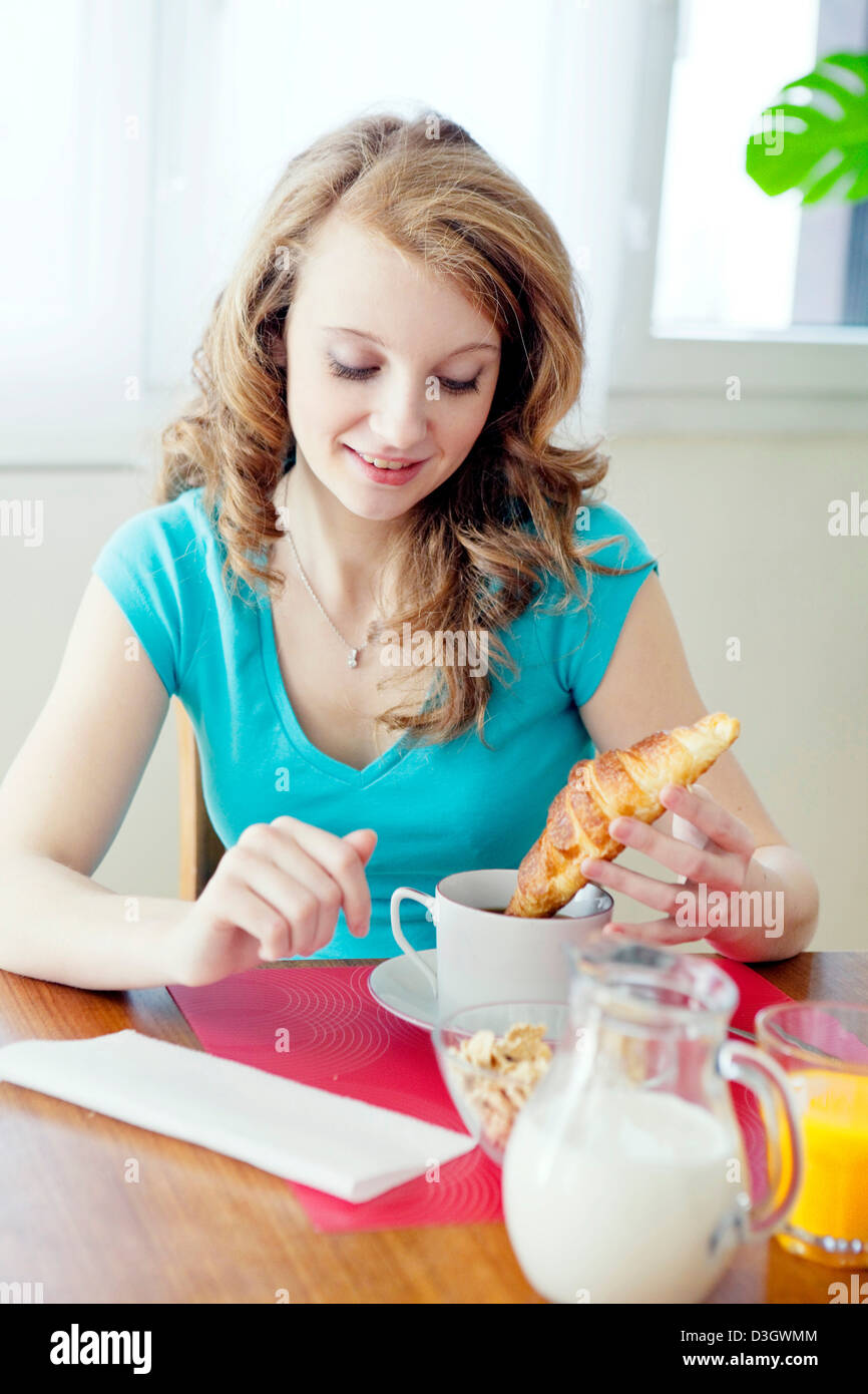 WOMAN EATING BREAKFAST Stock Photo - Alamy