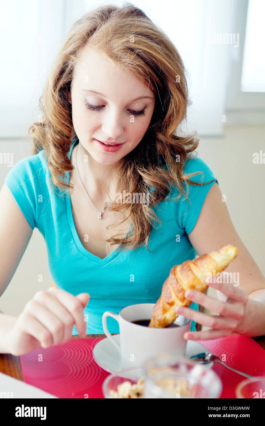 WOMAN EATING BREAKFAST Stock Photo - Alamy