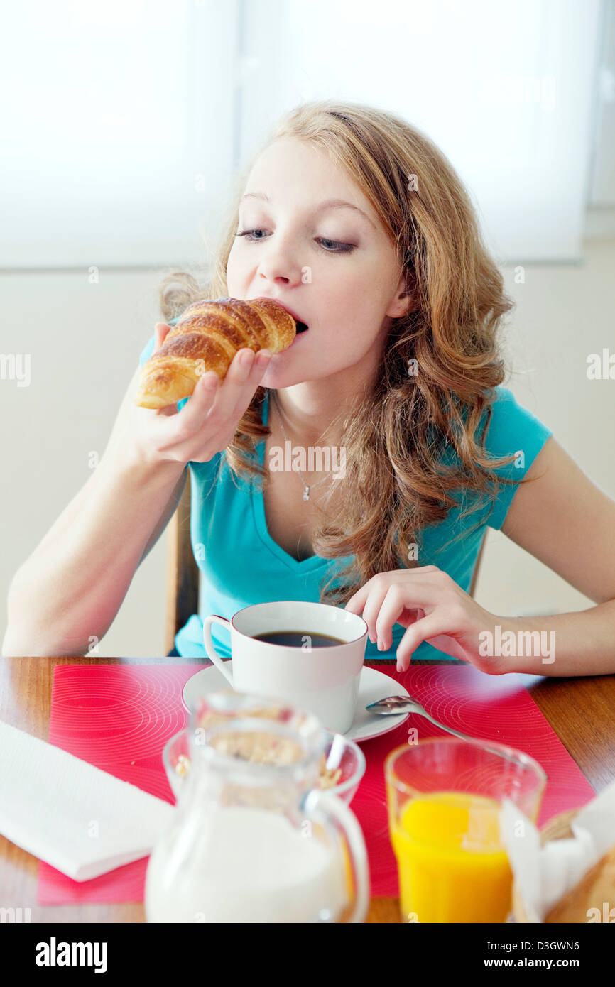 WOMAN EATING BREAKFAST Stock Photo - Alamy