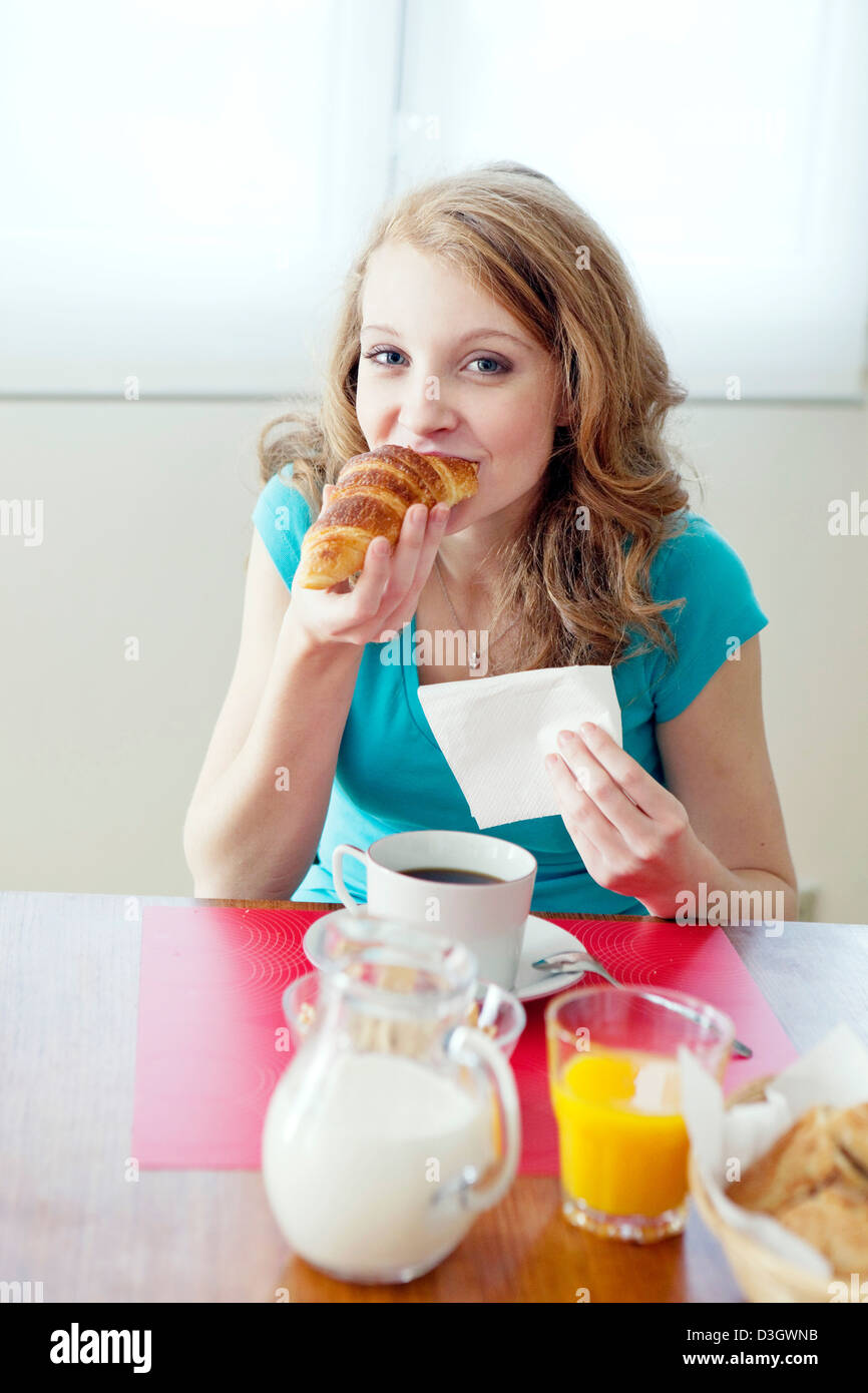 WOMAN EATING BREAKFAST Stock Photo - Alamy