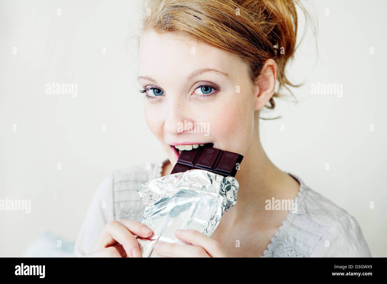 WOMAN EATING SWEETS Stock Photo - Alamy